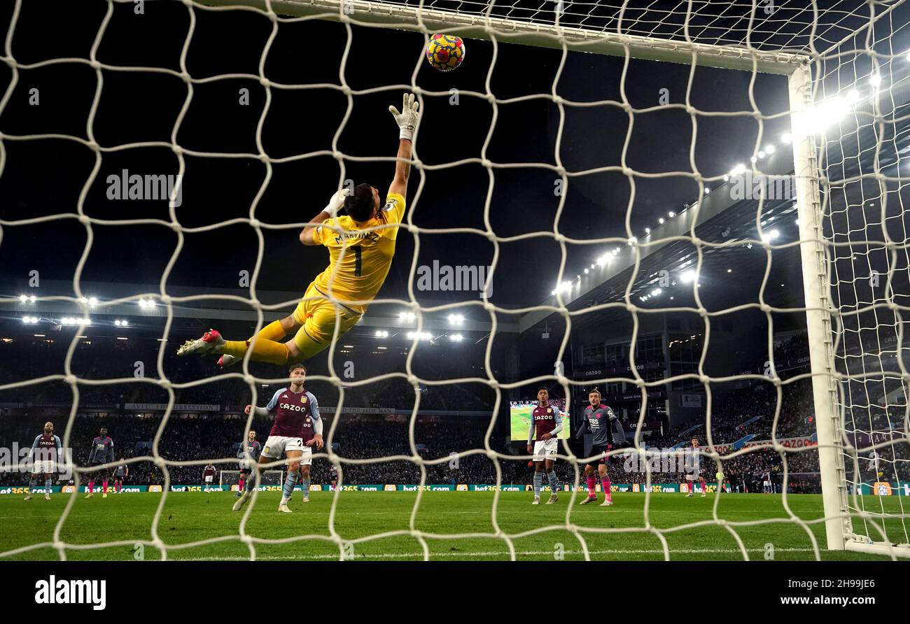 Aston Villa goalkeeper Emiliano Martinez makes a save from Leicester ...