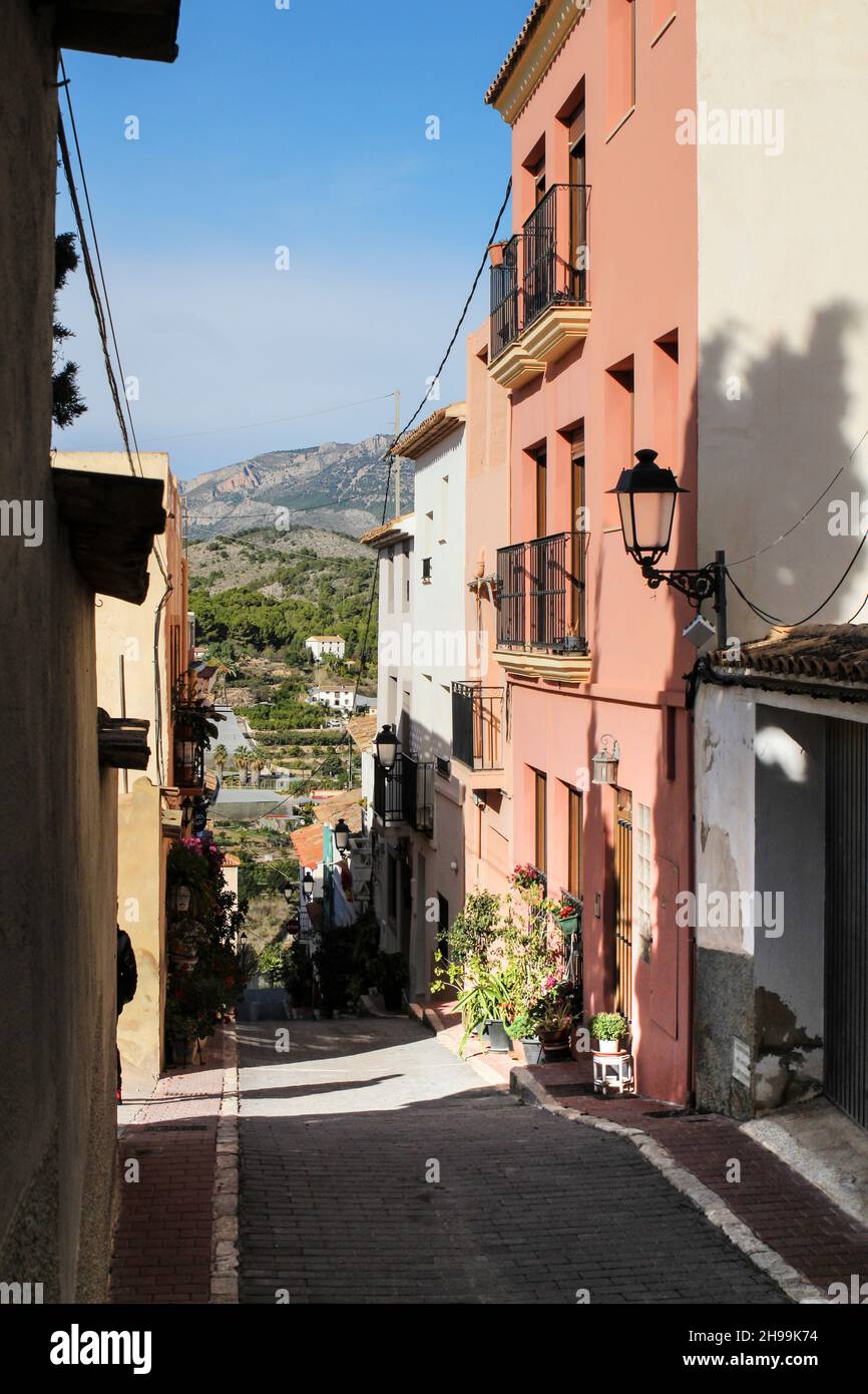 Narrow Street and typical facades of the Historical town of Polop in ...