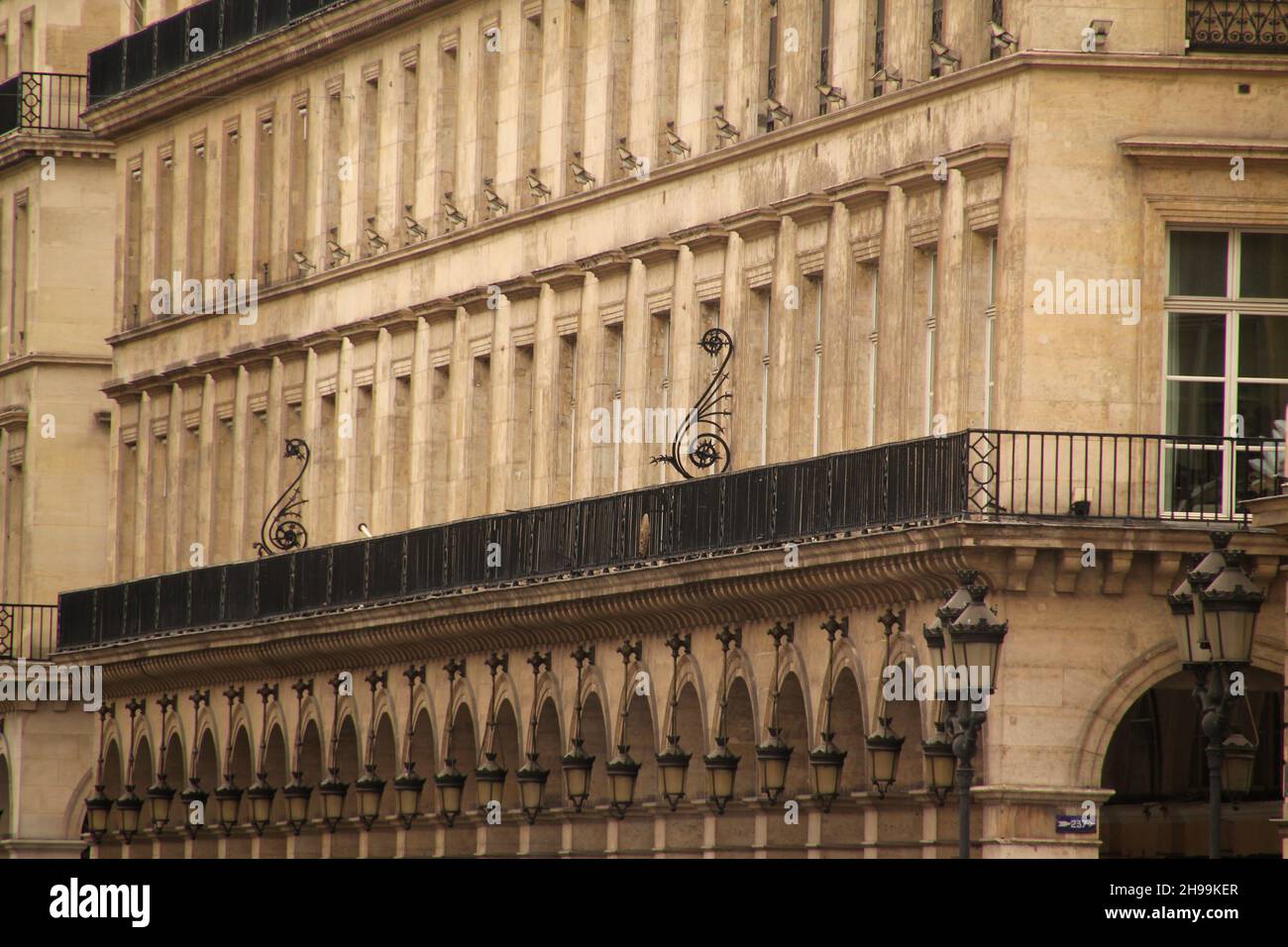 The exterior of a building with windows in Paris Stock Photo - Alamy