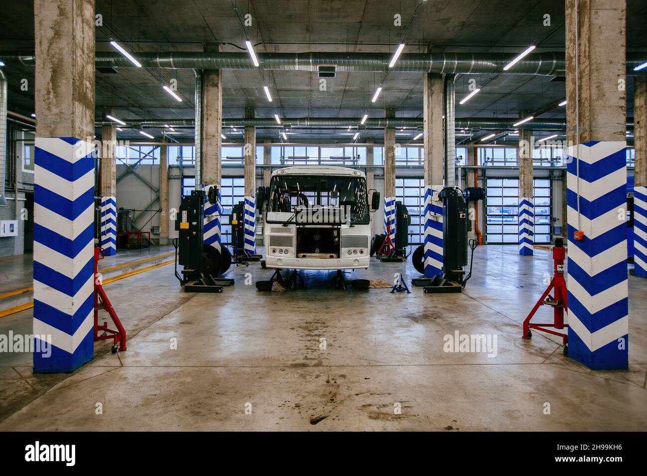 Buses in the modern repair service workshop Stock Photo - Alamy