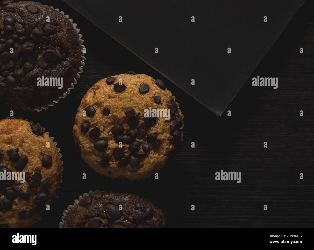 A closeup shot of delicious chocolate and vanilla muffins with ...