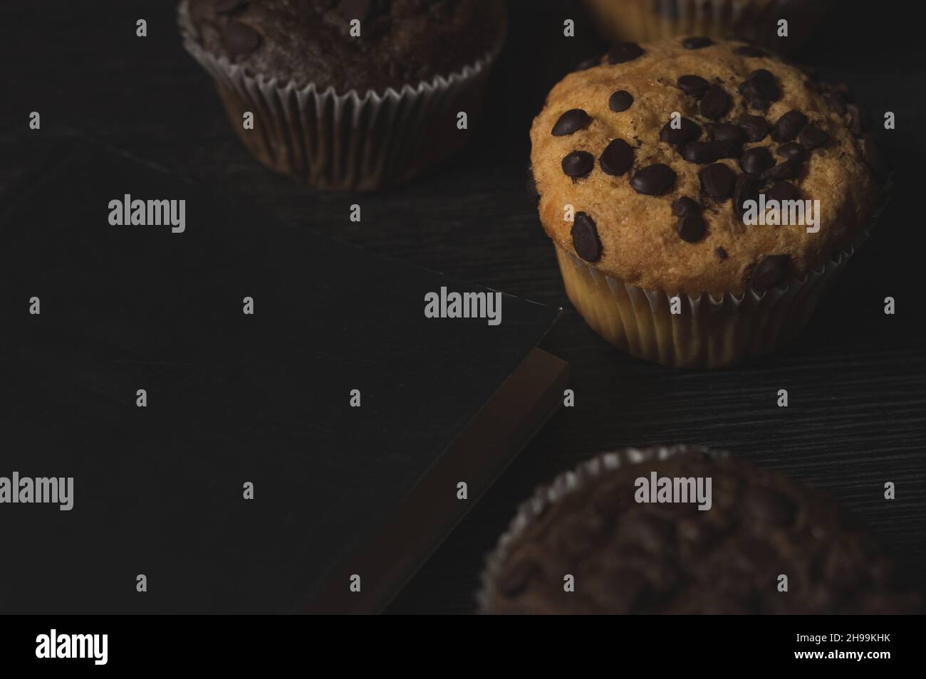 A closeup shot of delicious chocolate and vanilla muffins with ...