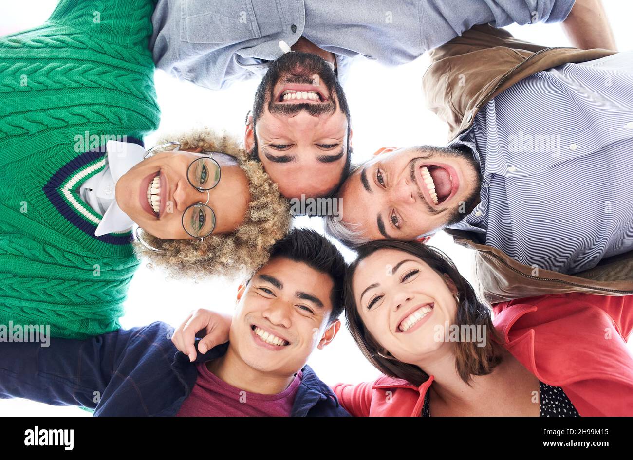 Multiracial group of friends having fun. Group of people standing in ...