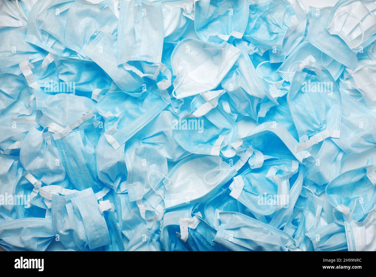 The background mask is used. Disposal of the coronavirus. Garbage mask ...