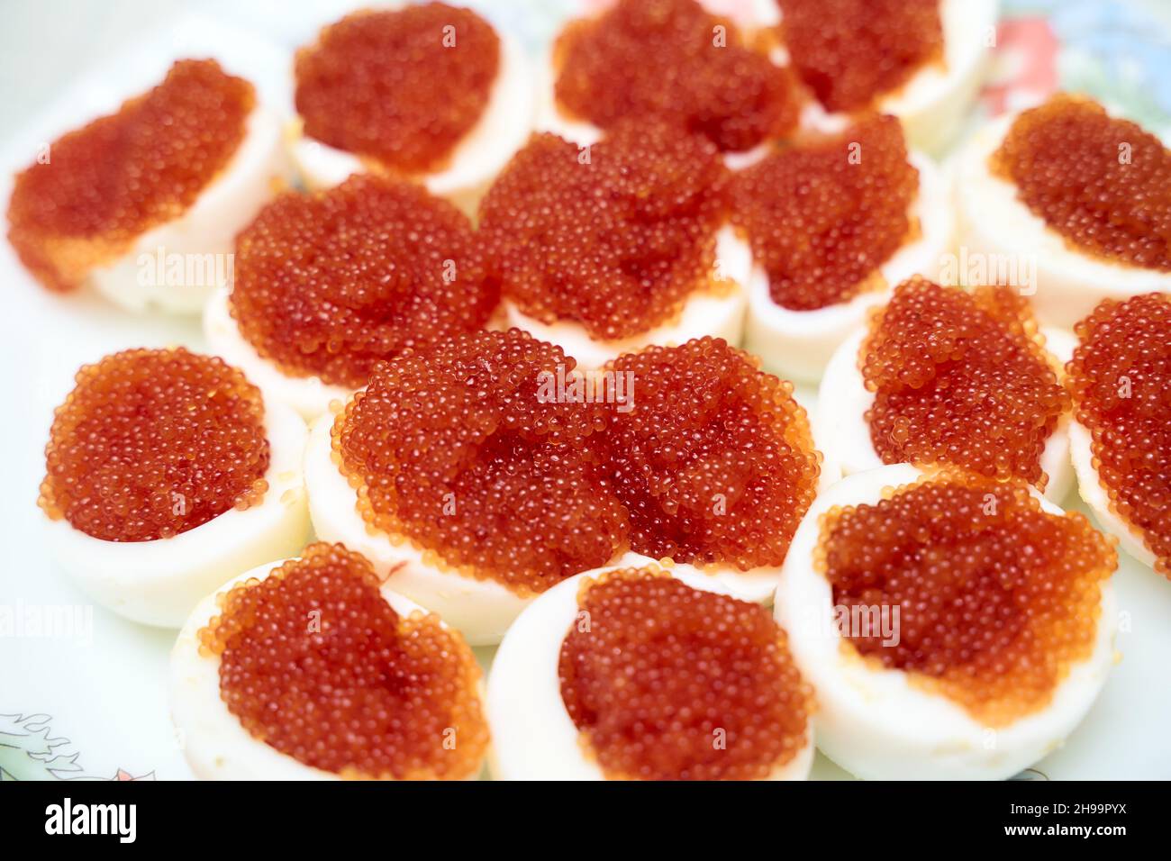 Pike roe salted in cut boiled eggs. Close Up Stock Photo - Alamy