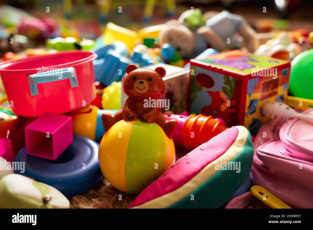 Children's toys. A view of a bear-shaped feller. The rest of the toys ...