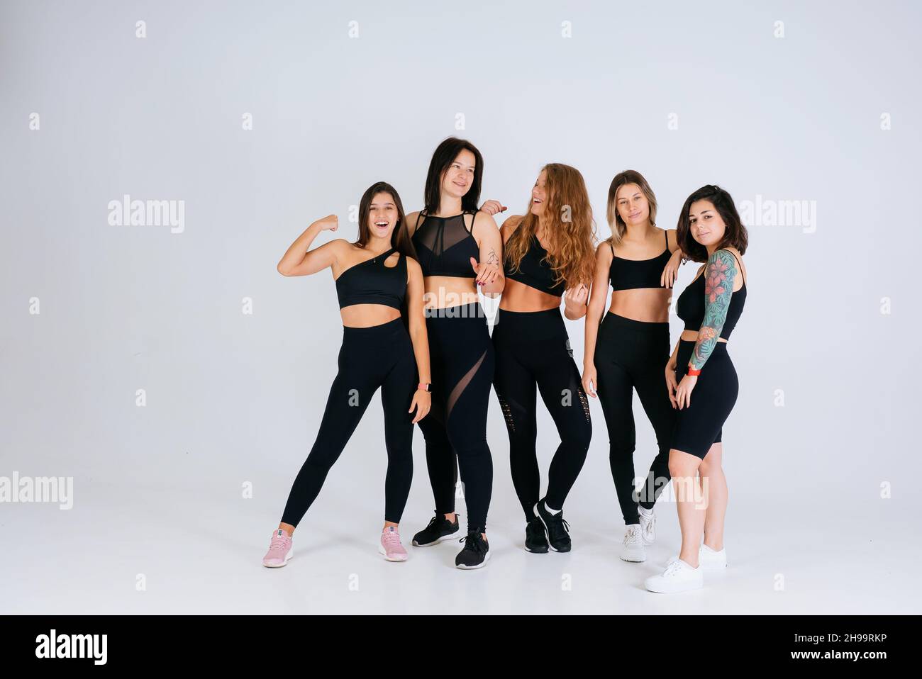 diverse models laughing, enjoying time together, look at camera Stock ...