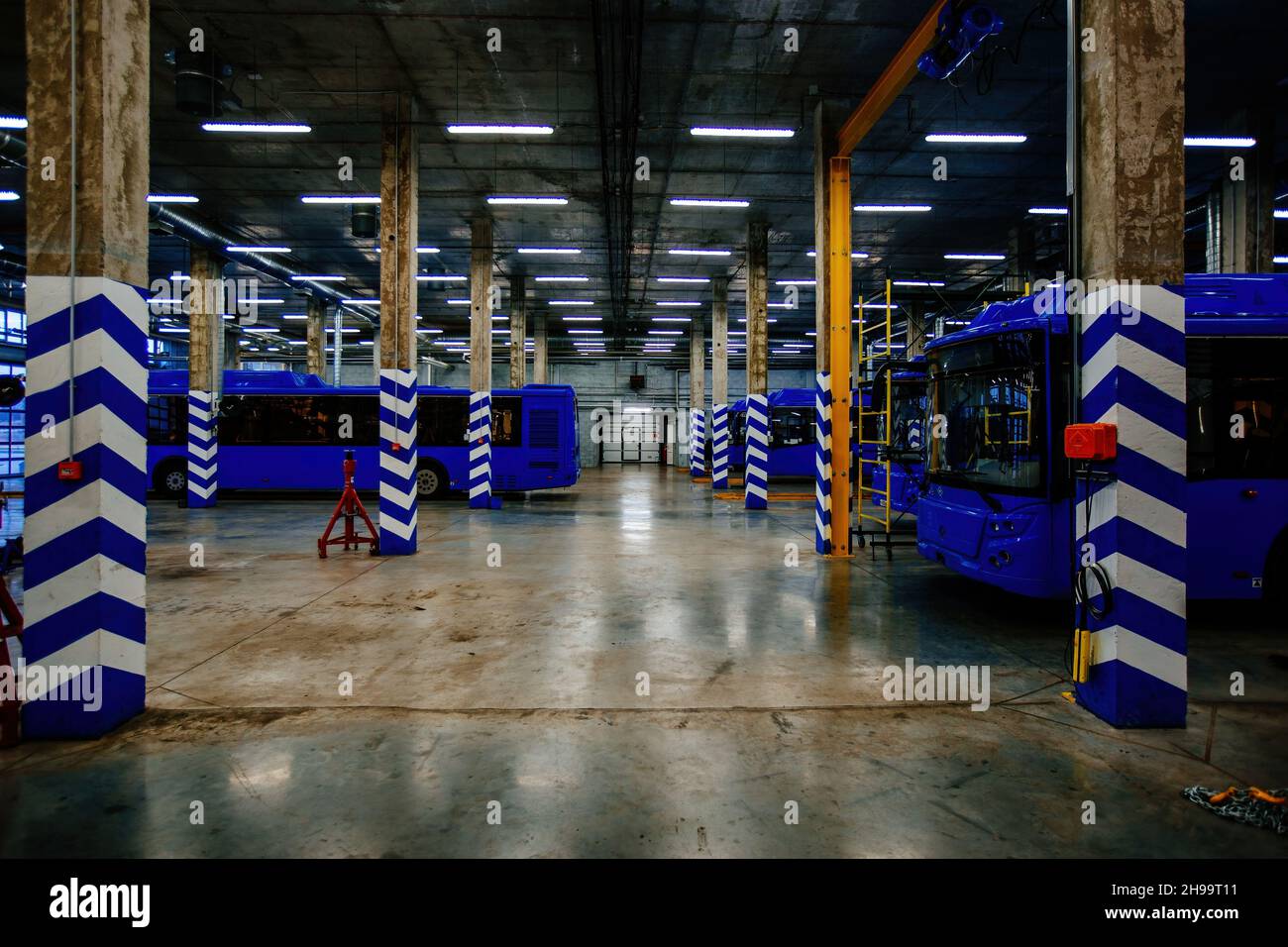 Buses in the modern repair service workshop Stock Photo - Alamy