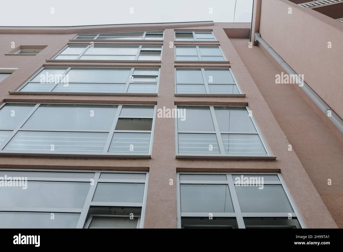 A low angle shot of a residential building on the sky background Stock ...