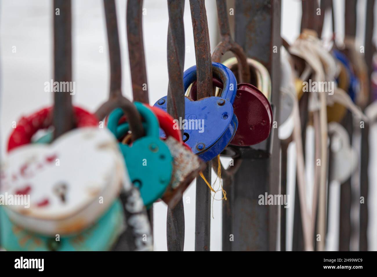 Door locks are hung on the railing of the bridge as a symbol of the ...