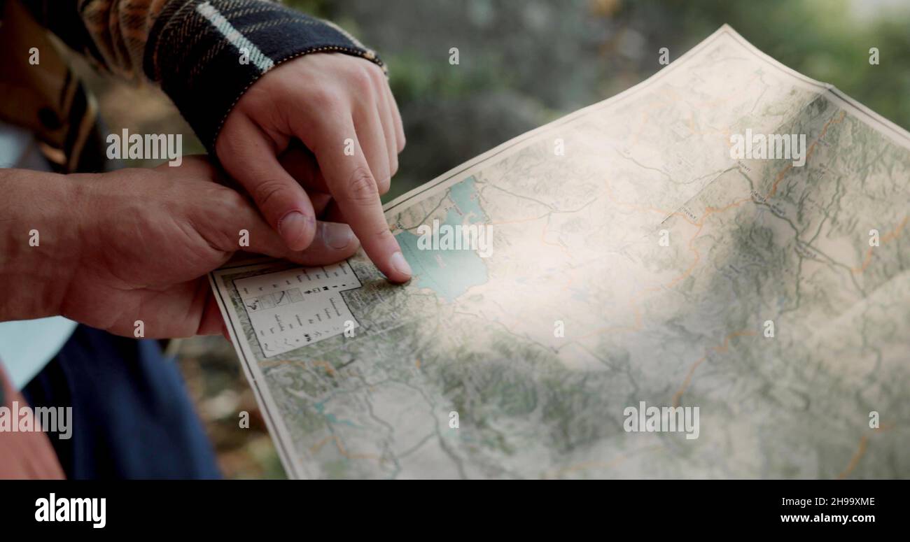 A man and a boy are reading a map Stock Photo - Alamy