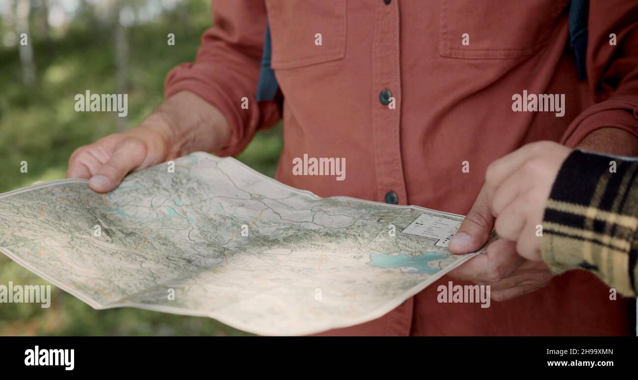 A man is reading a map Stock Photo - Alamy