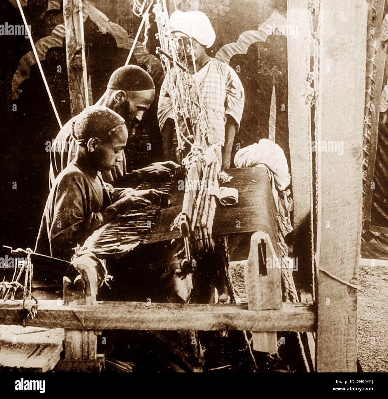 Weaving shawls on a hand loom, Kashmir, early 1900s Stock Photo - Alamy
