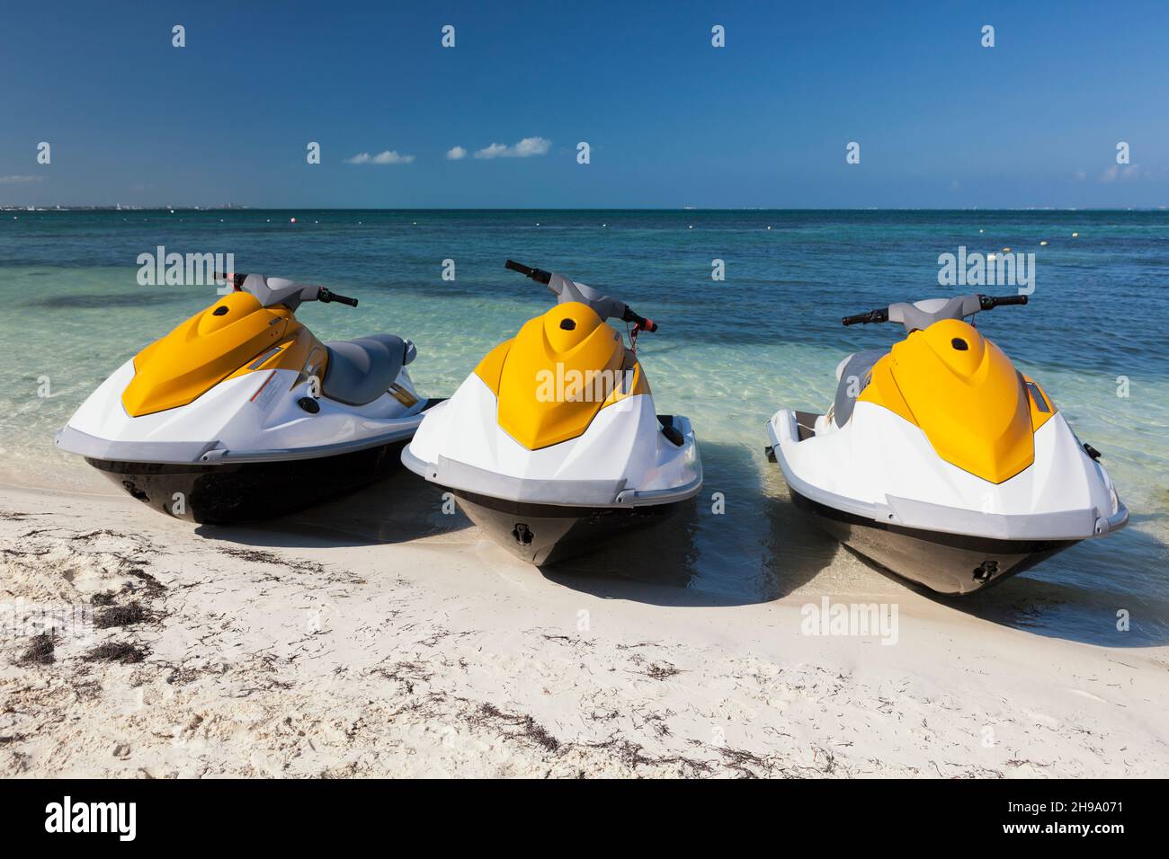 Three jet skis on the beach Stock Photo - Alamy
