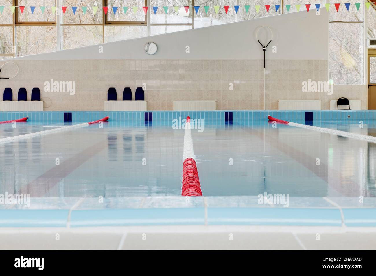 Indoor swimming pool, red and white dividers in swim lanes, surface ...
