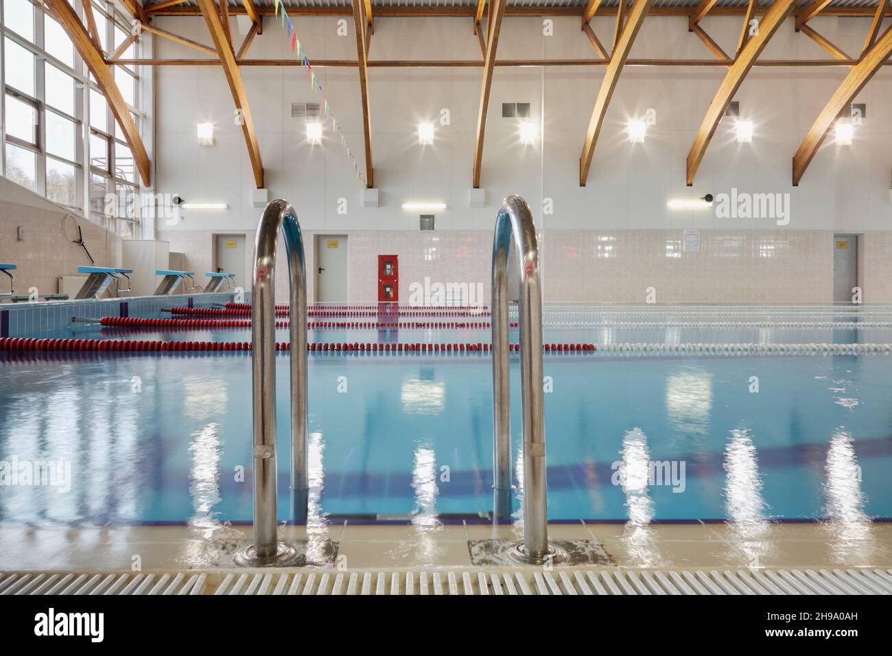 Steps into an indoor swimming pool Stock Photo - Alamy