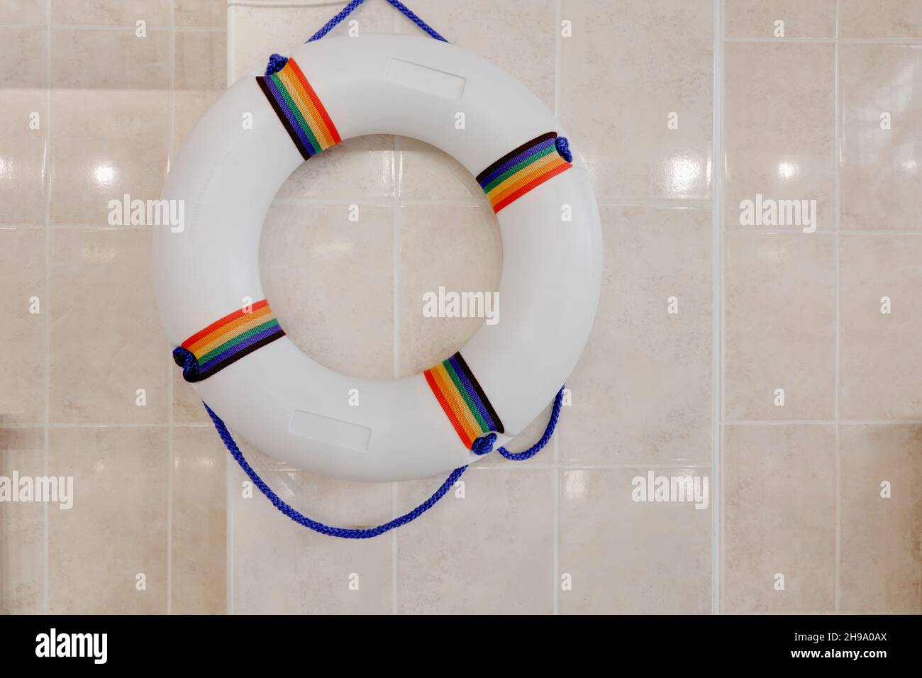 Life preserver, life ring on a wall in an indoor swimming pool Stock ...