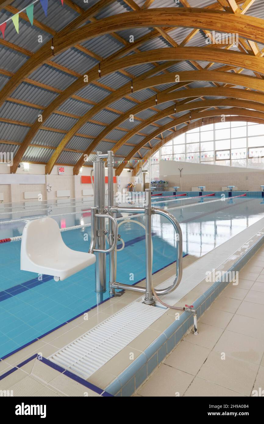 Indoor swimming pool, a chair and hoist for disabled people Stock Photo ...