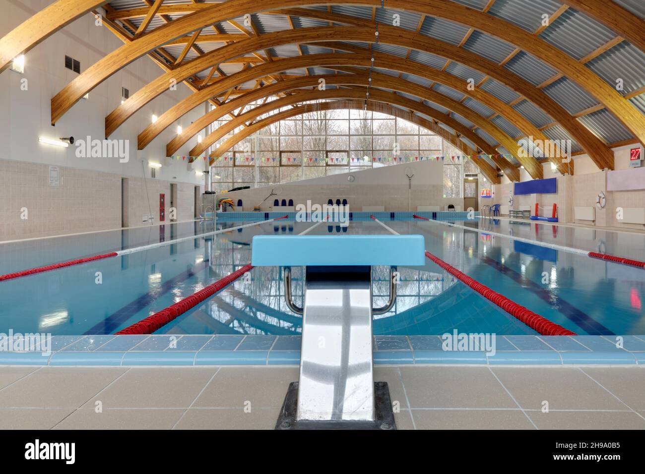 Indoor swimming pool, starting block, diving block and marked lanes ...