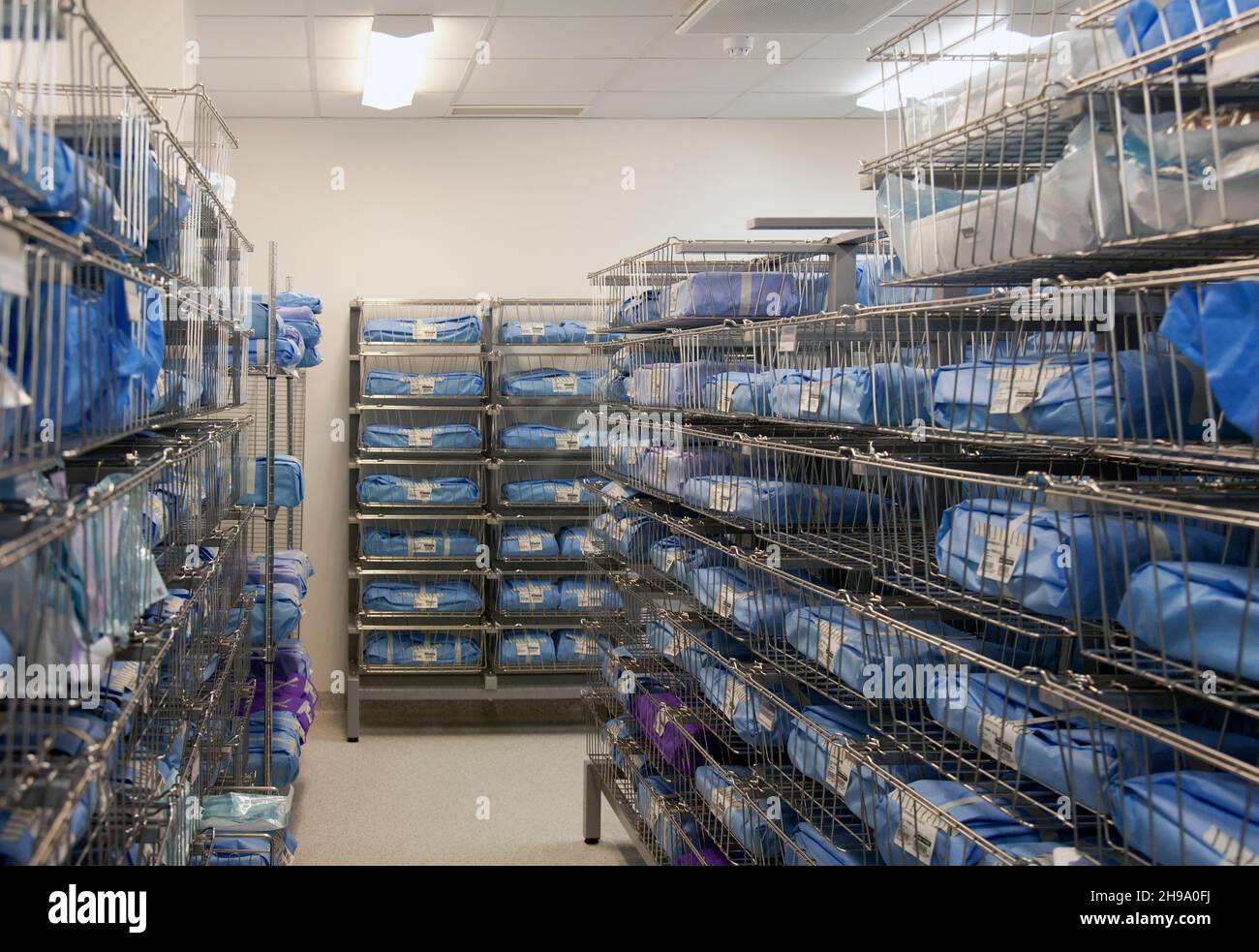 Storage room in a modern hospital, rows of sterile equipment packs in ...