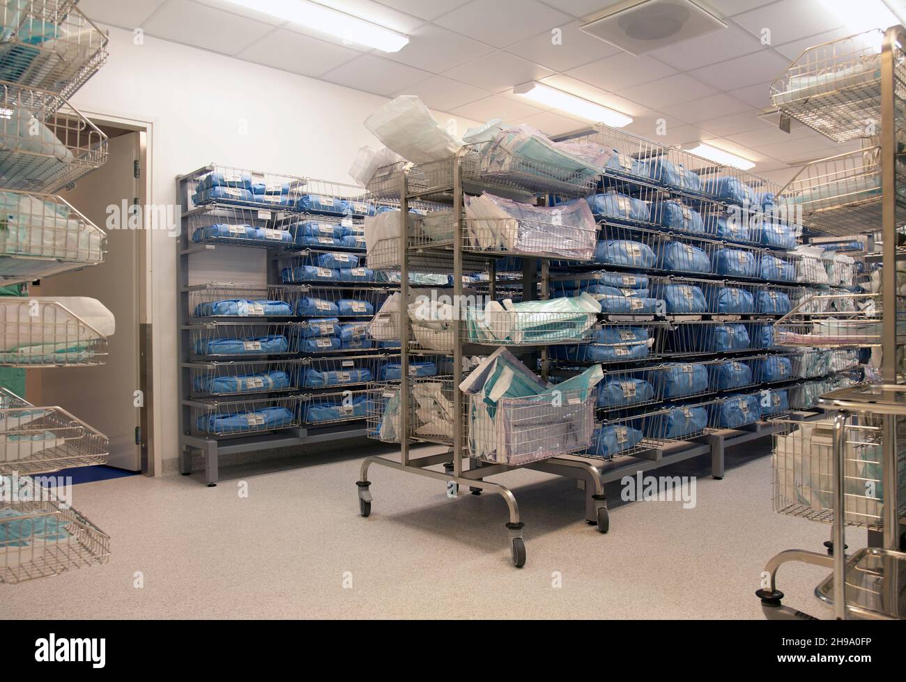 Storage room in a modern hospital, rows of sterile equipment packs in ...