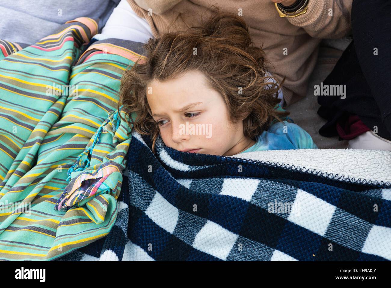 Young boy resting under blanket, De Kelders, Western Cape, South Africa ...