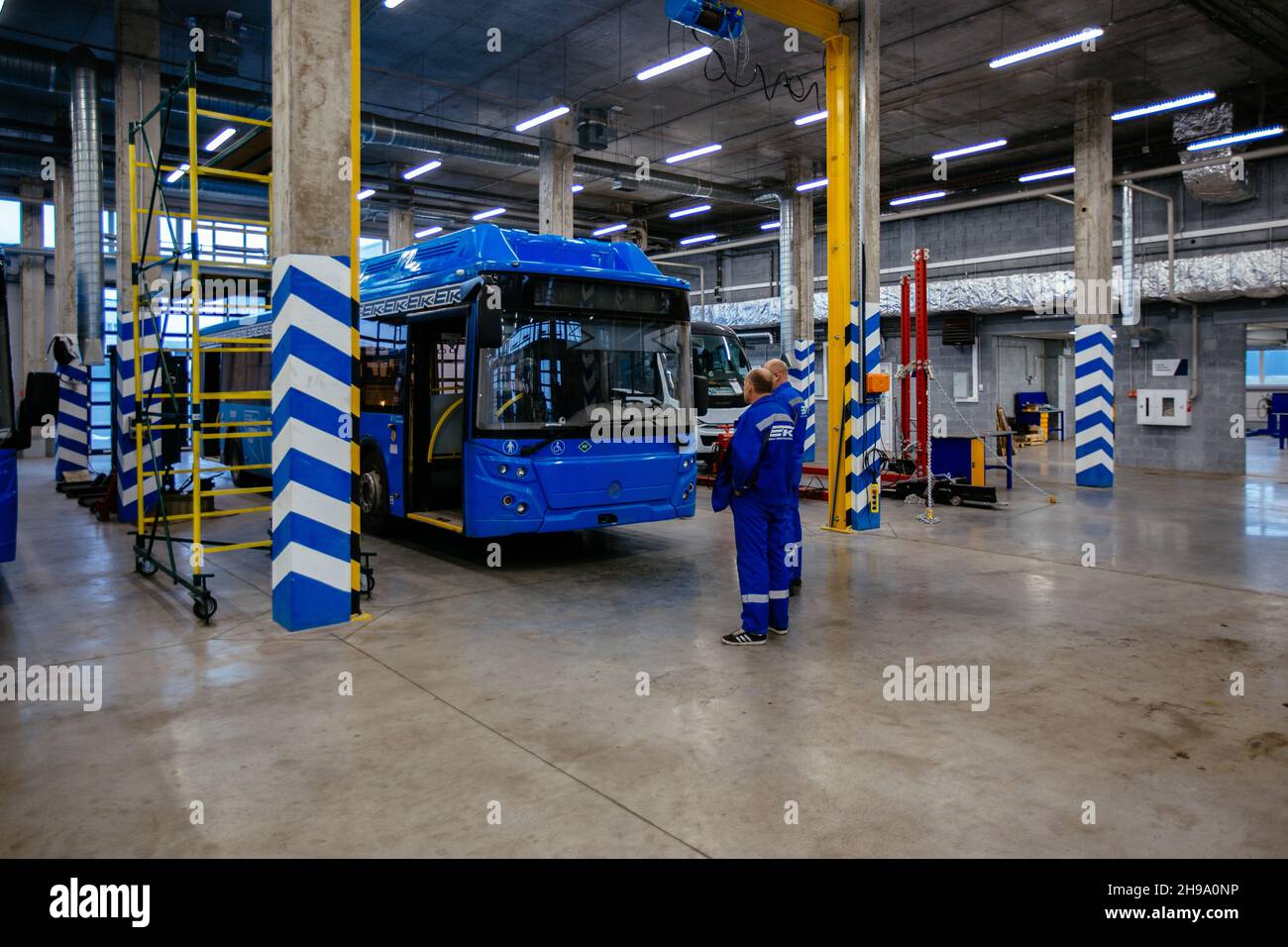 Buses in the modern repair service workshop Stock Photo - Alamy