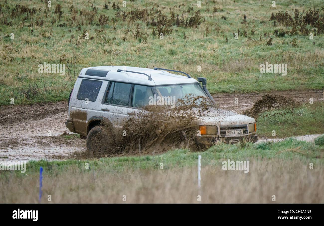 Land Rover Discovery II 2 4x4 off-road vehicle driving across mud and ...
