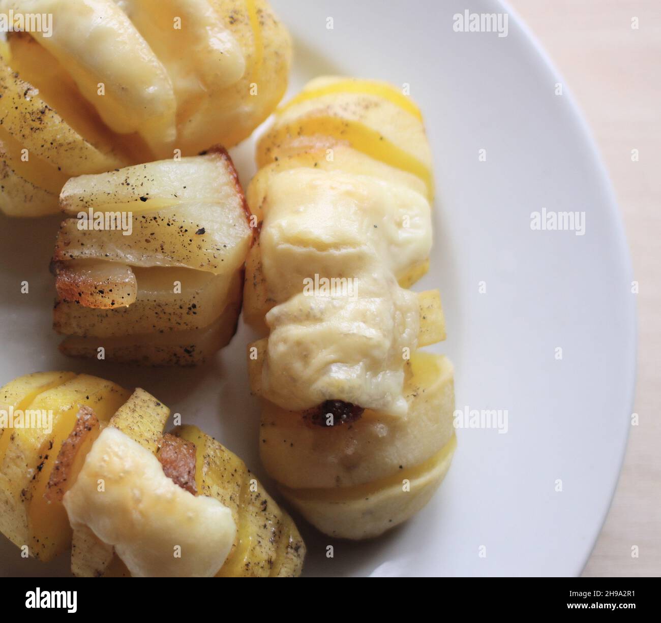 Baked potatoes with meat and cheese Stock Photo - Alamy