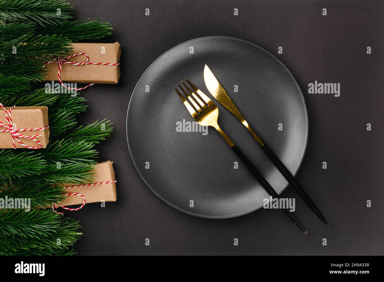 flat lay served with festive dishes black Christmas table with frame of ...