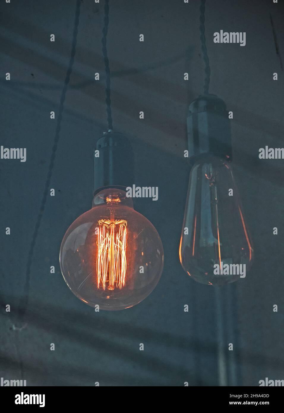 Background image of an outdoor lamp, focus on a classic light bulb with ...