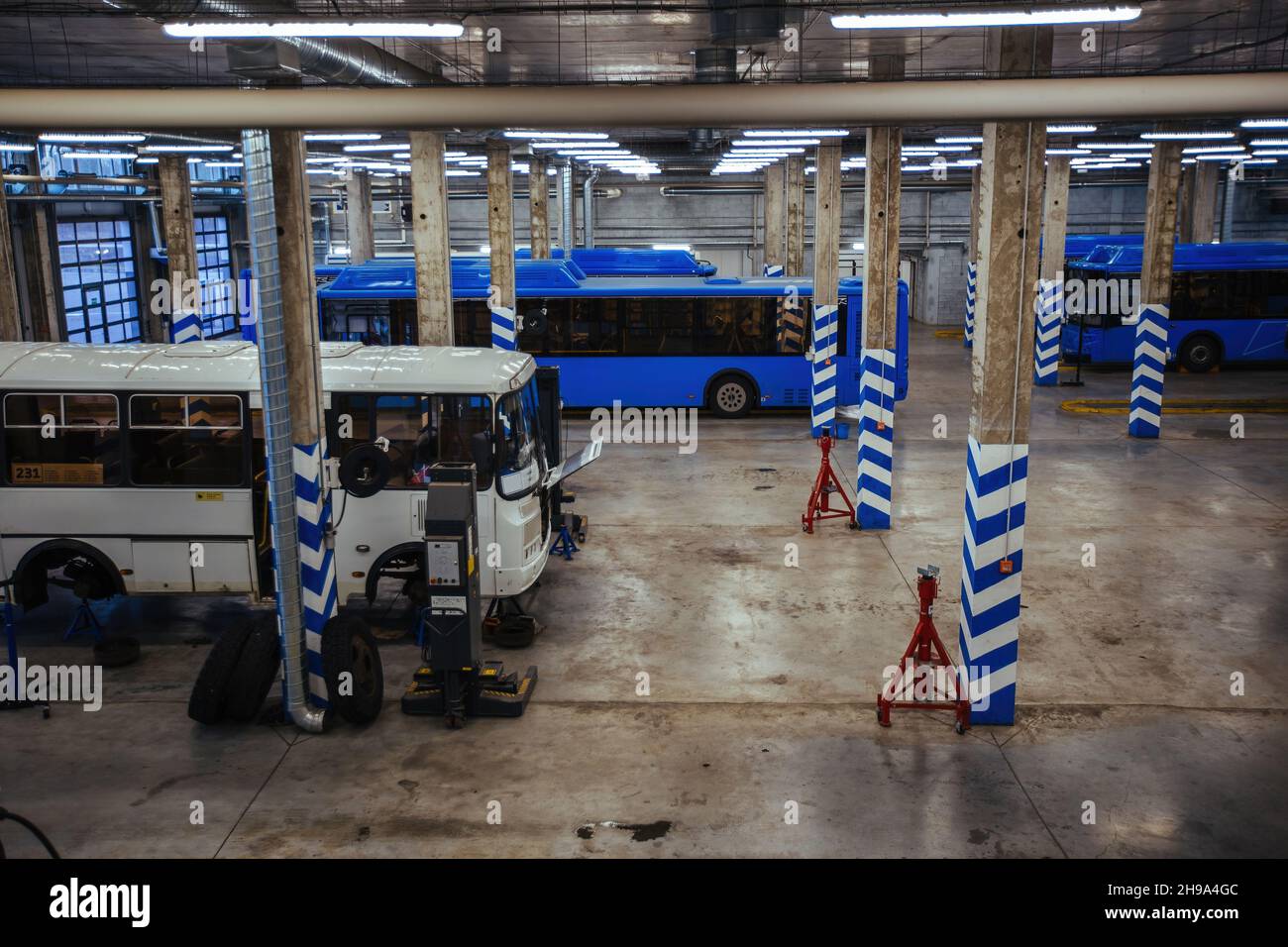 Buses in the modern repair service workshop Stock Photo - Alamy
