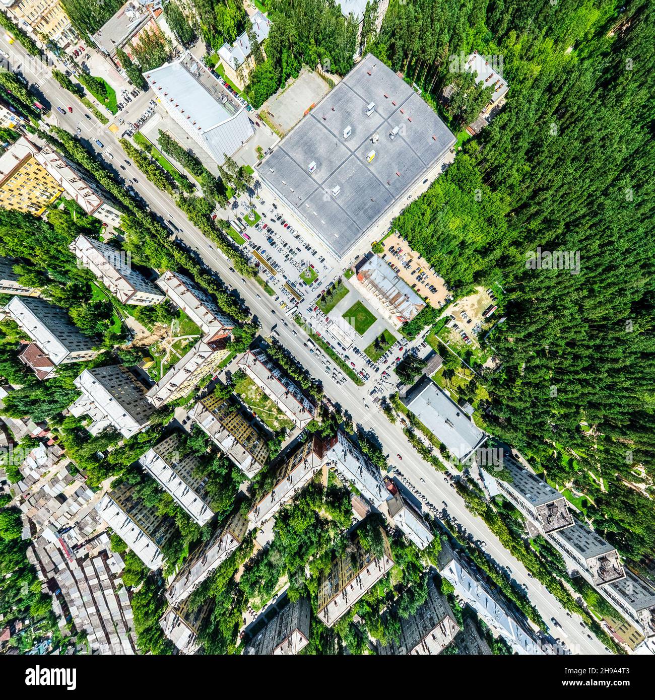 Aerial city view with crossroads and roads, houses, buildings, parks ...