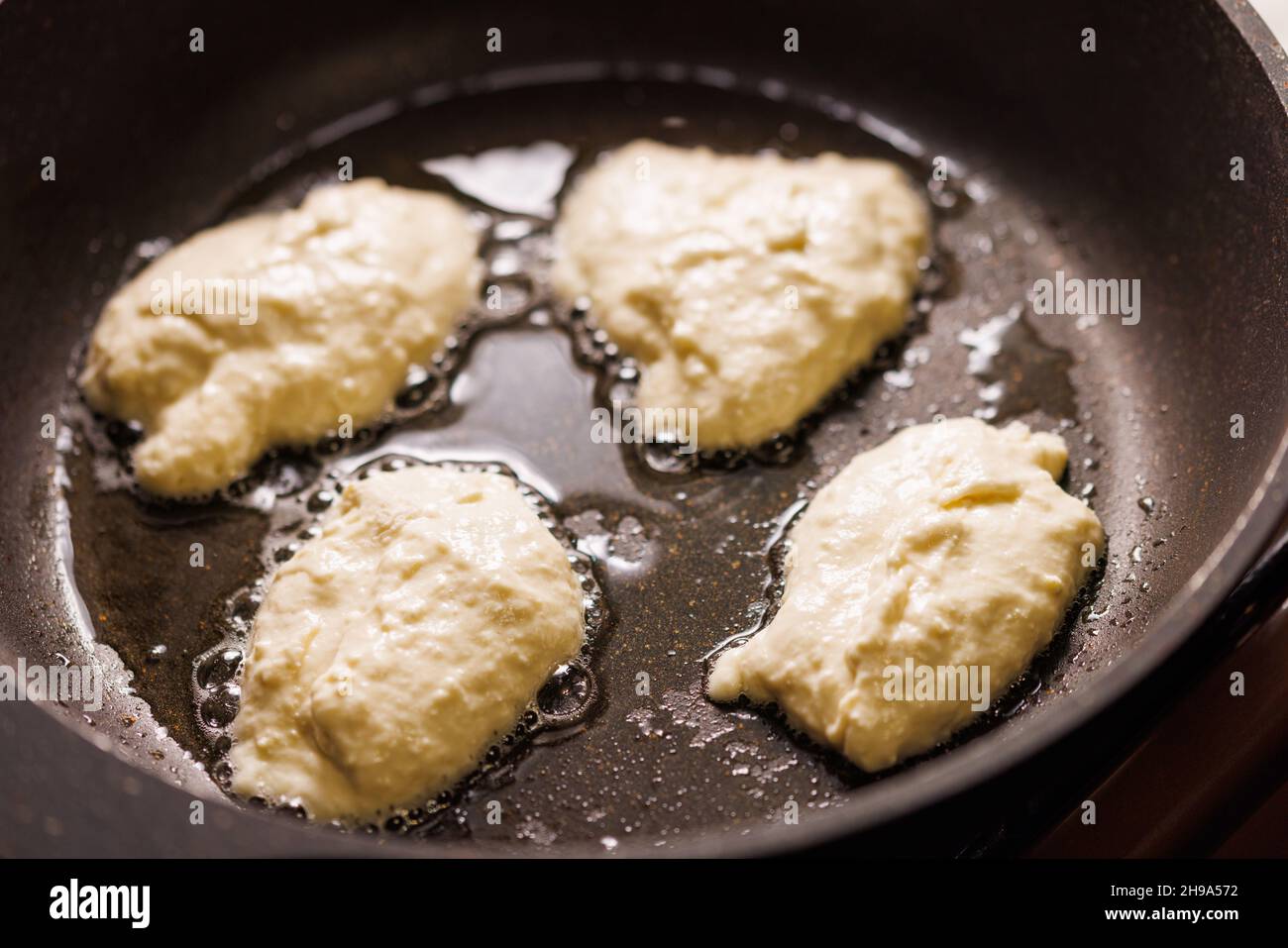 process of roasting traditional pancakes on skillet with sunflower seed ...