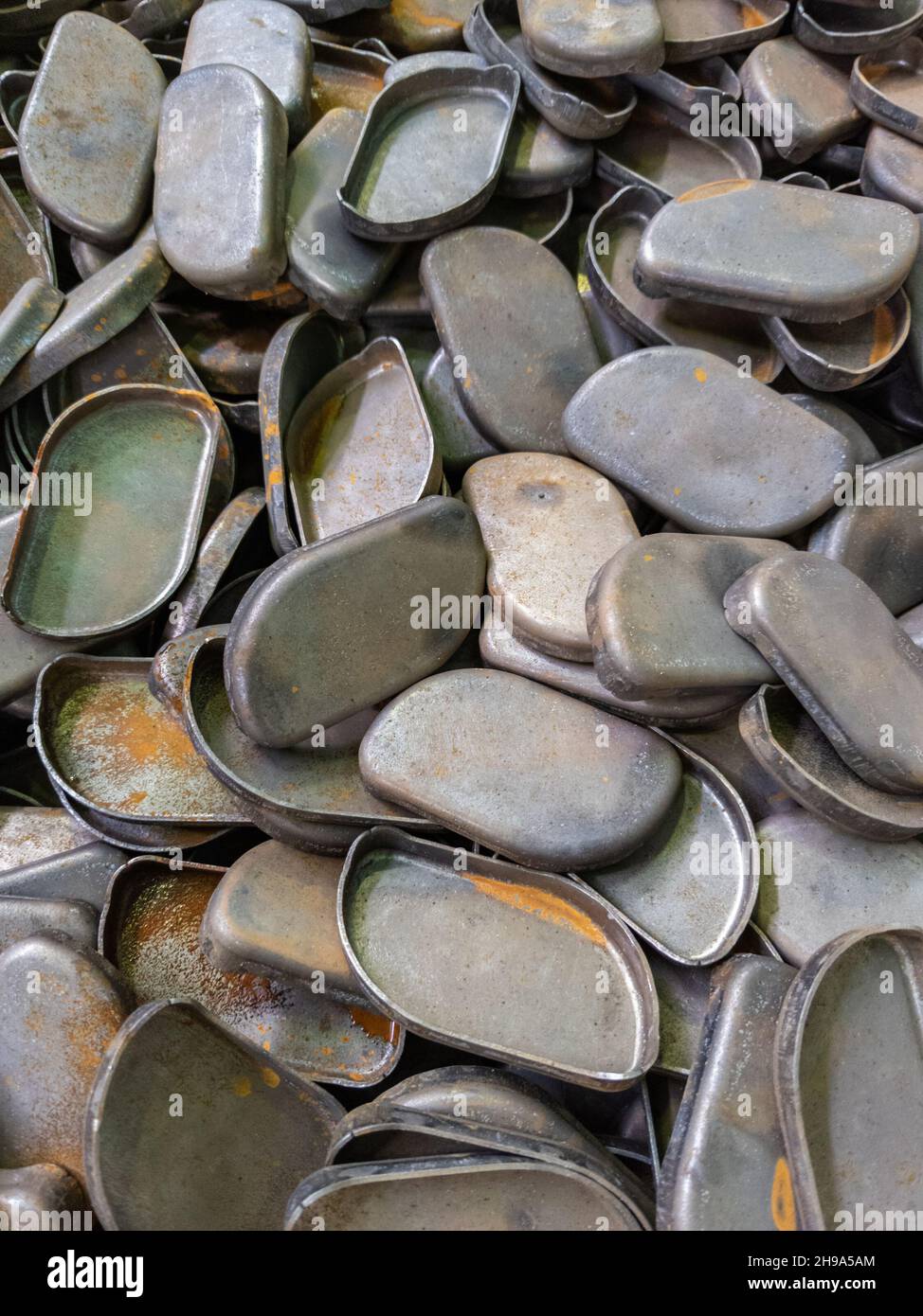 full frame background of many stamped parts made of sheet metal with ...