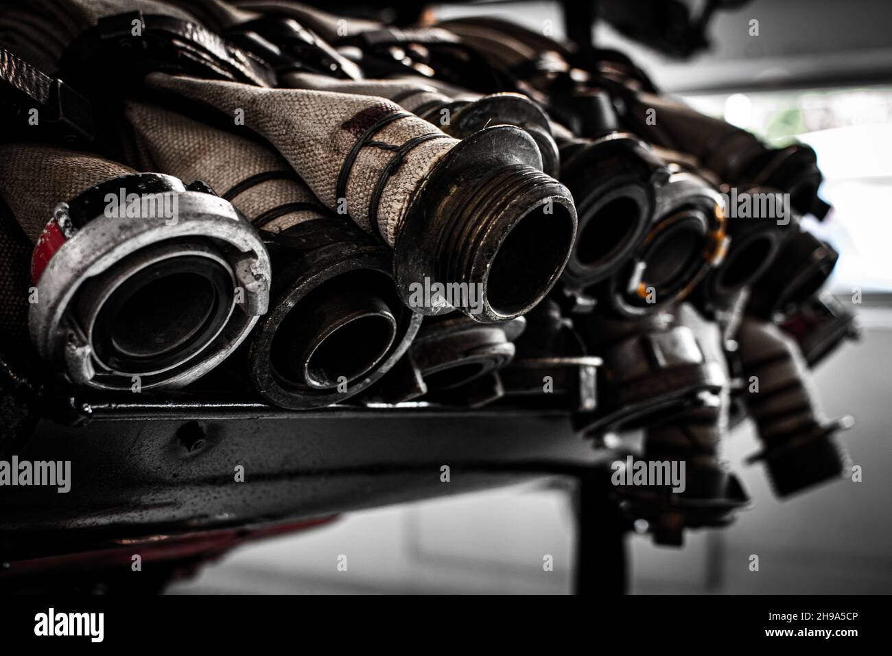 Close up a firefighter historical pipes ready on the truck Stock Photo ...