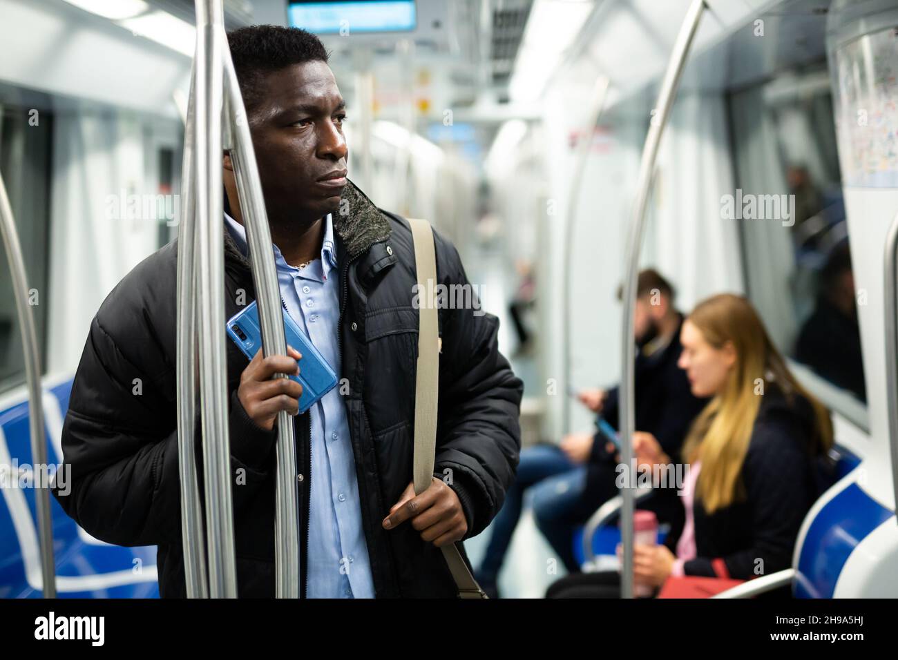 African man in metro train Stock Photo - Alamy