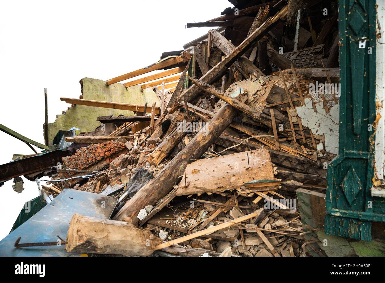 Ruins of demolished building with broken wall, debris of bricks and ...