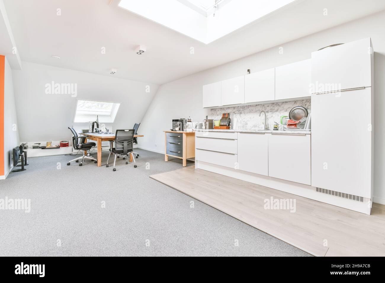 Combined large room with kitchen and work area Stock Photo - Alamy