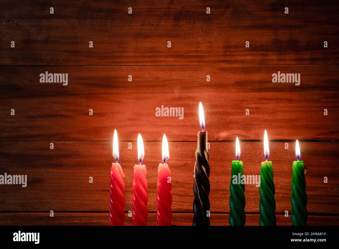 Happy Kwanzaa. African American holiday. Seven burning candles, red ...