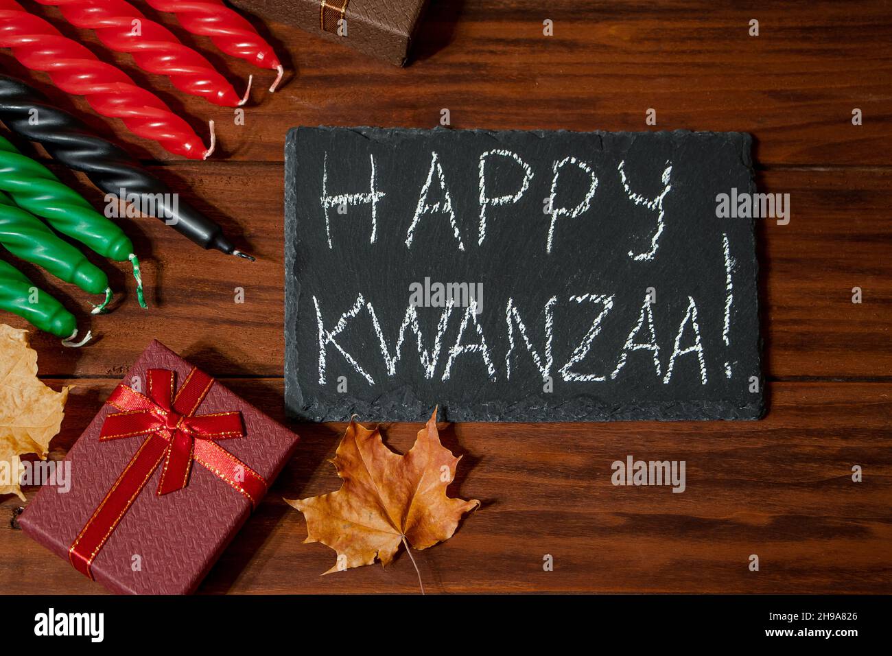 Kwanzaa African American holiday. Seven candles red, black and green on ...