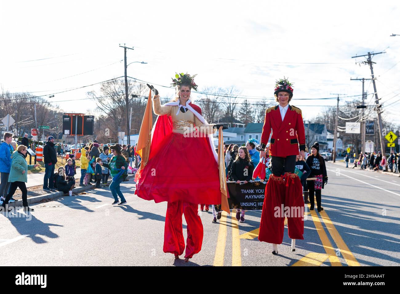 Two people in costume and on stilts at the Christmas and Holiday Parade ...