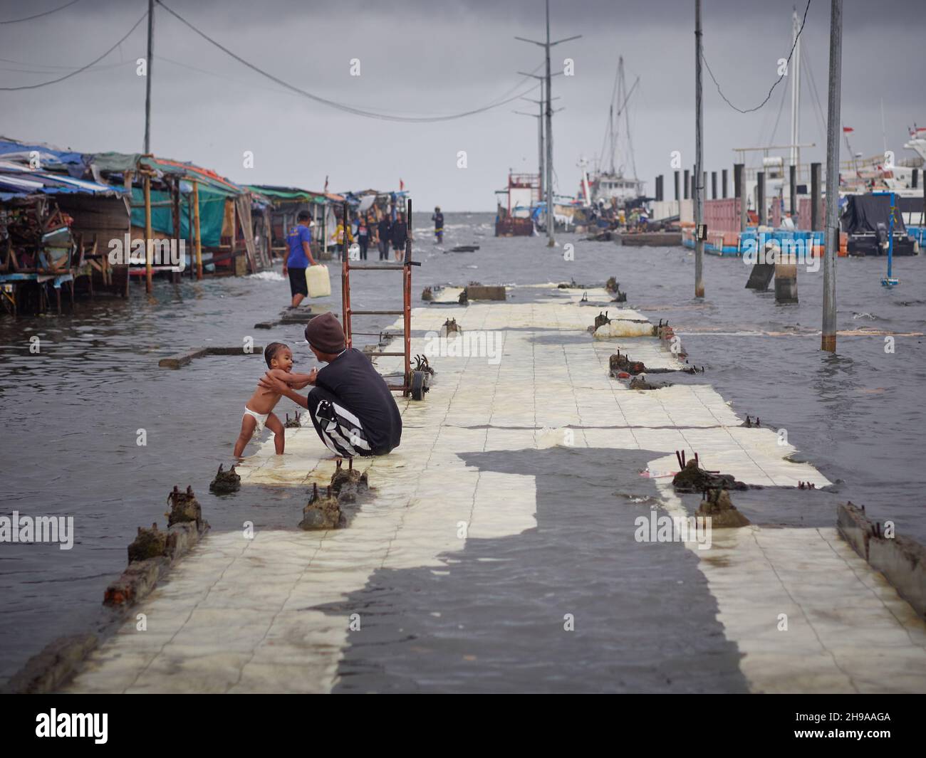 A view of the tidal floods that hit Muara Angke area in North Jakarta ...