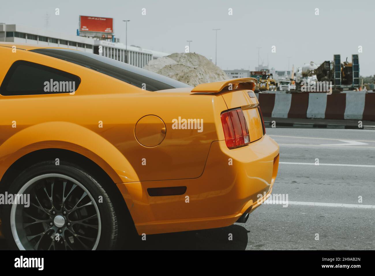 Yellow super car driving on the road at a daytime Stock Photo - Alamy