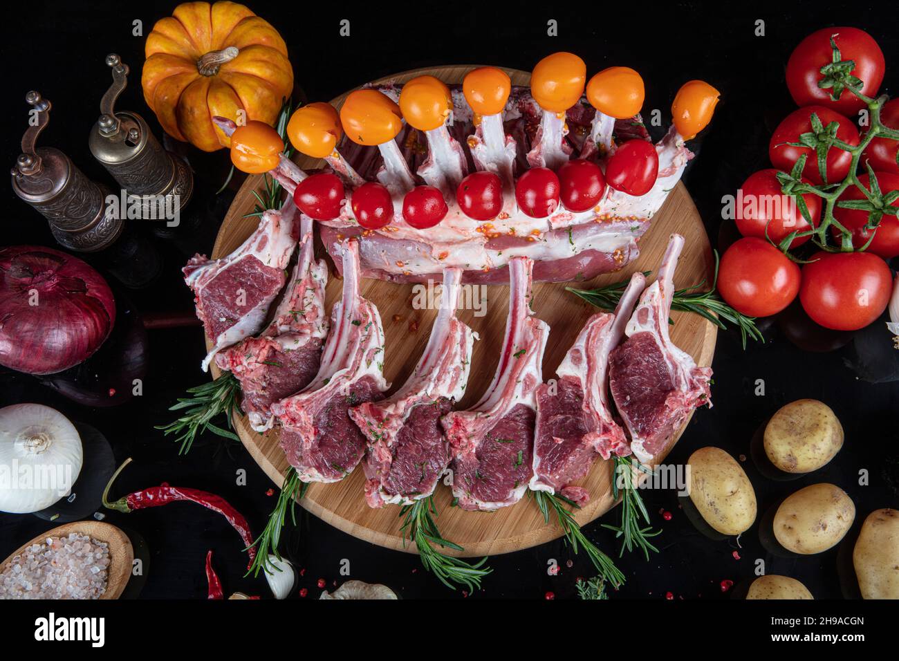 Raw fresh rack of lamb with green herbs. Racks of lamb ready for ...