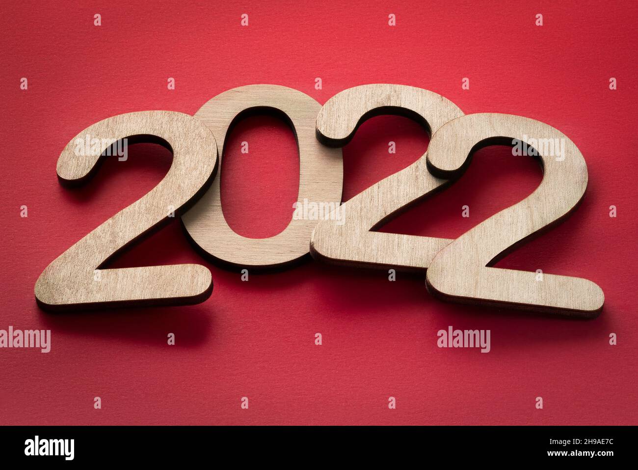 2022 numbers lying on the red paper with shadows Stock Photo - Alamy