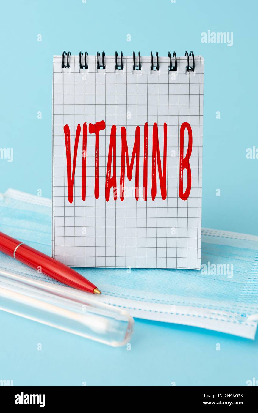 Hand writing sign Vitamin B. Word Written on Nutrient that helps keep ...