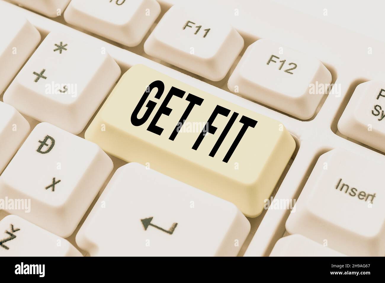 Conceptual caption Get Fit. Word Written on right size or shape for ...