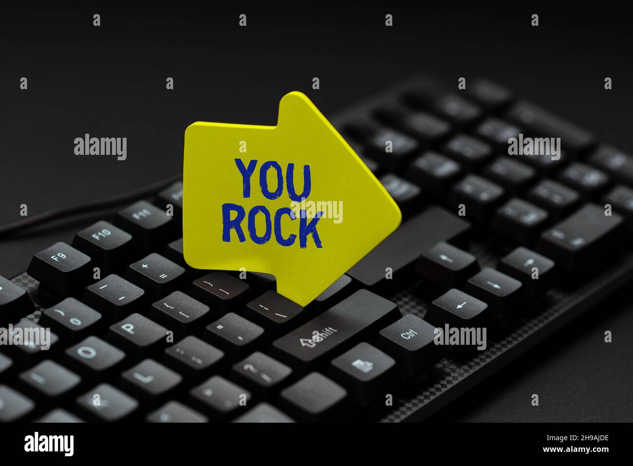 Hand writing sign You Rock. Concept meaning slang phrase of praise or ...