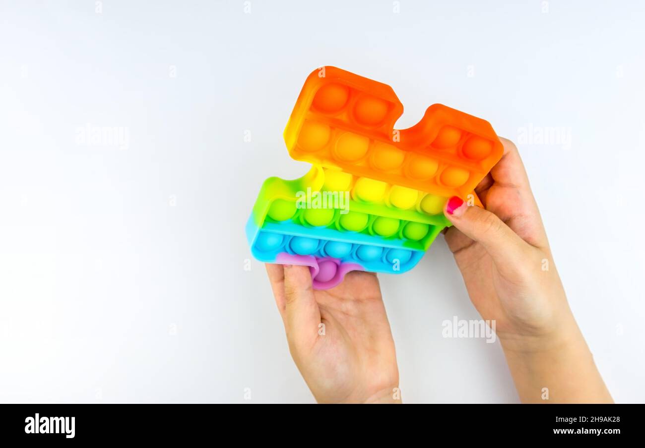 Girl Holding Anti Stress Popit Toy Isolated On The White Background 1610